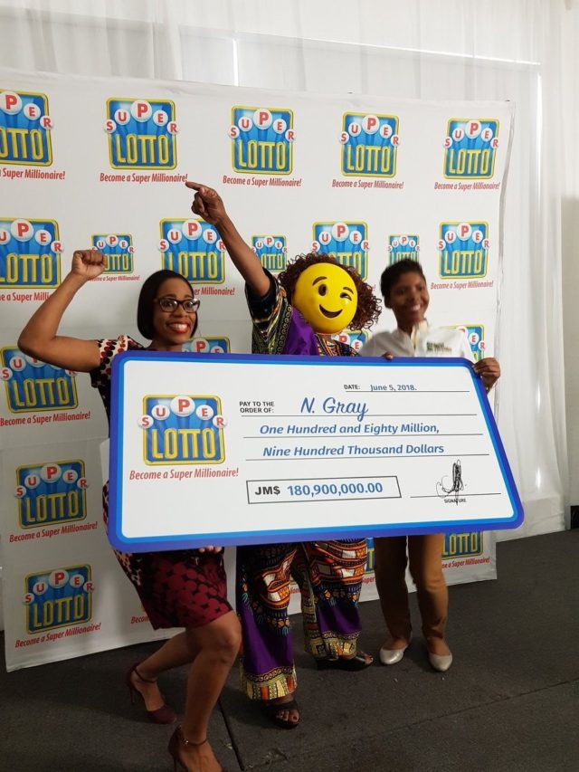 Jamaican lottery winner shows up in a mask to claim her $180 Million prize