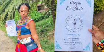 Mixed reactions as pretty lady proudly flaunts her certificate of virginity